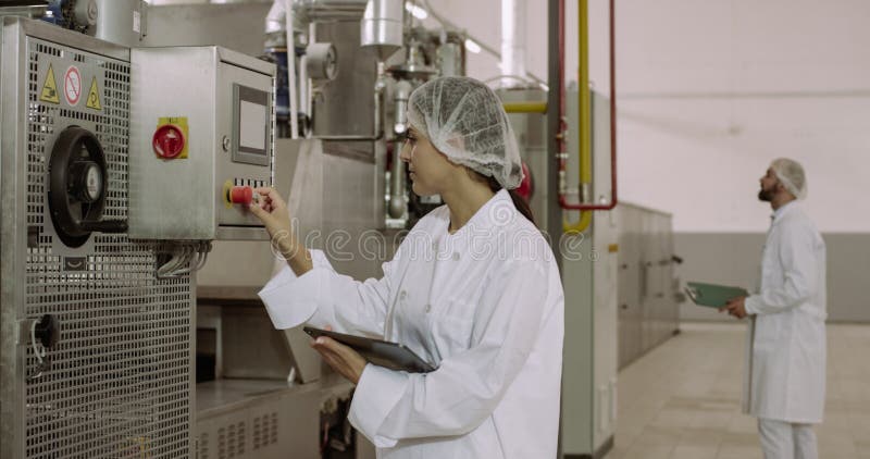 In the Morning Two Beautiful Engineers in Manufacturing Industry Check ...