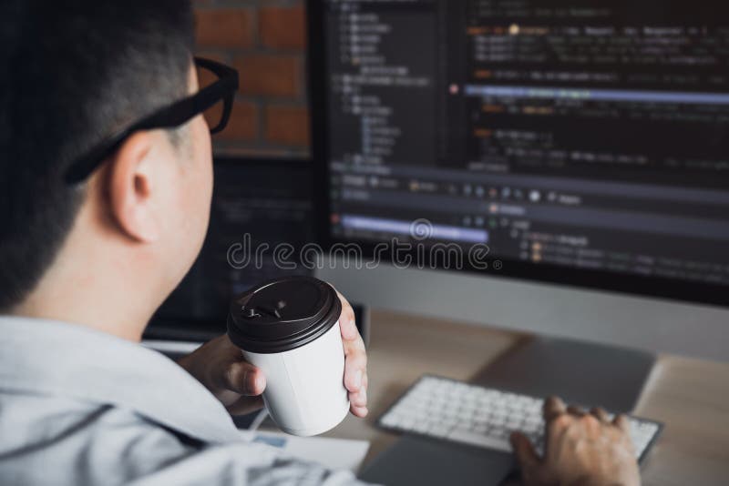 In the Morning of Work with a Program Developer Holding a Coffee at the ...