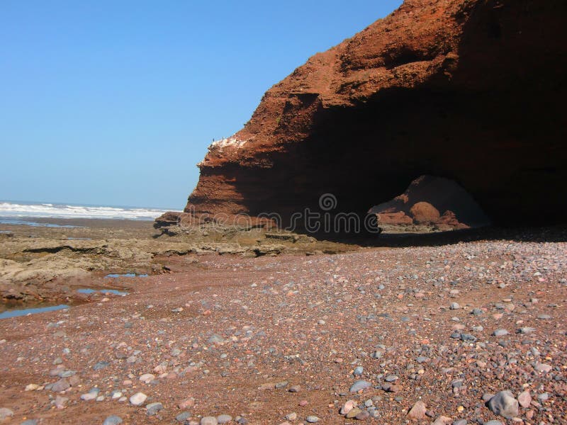 Moroccan beach with a rock stock photo. Image of ocean - 74722522