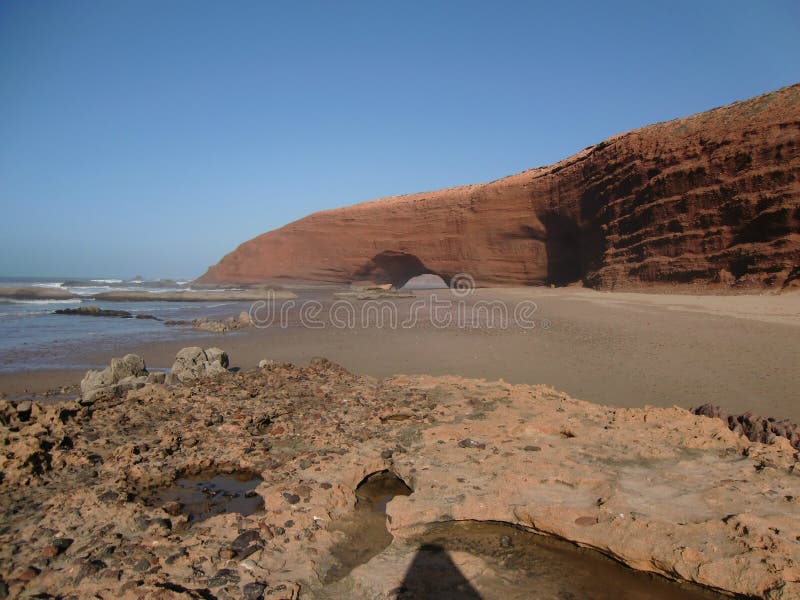Moroccan beach with a rock stock photo. Image of cloudless - 74722544