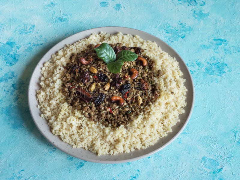 Moroccan Spiced Mince with Couscous in a Plate. Stock Image - Image of ...
