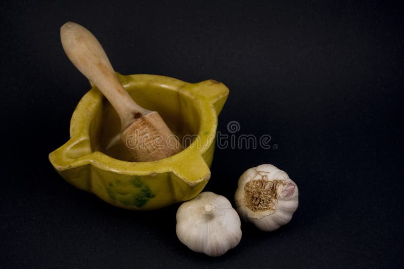 Mortar with garlic. stock image. Image of isolated, garlic - 11321283