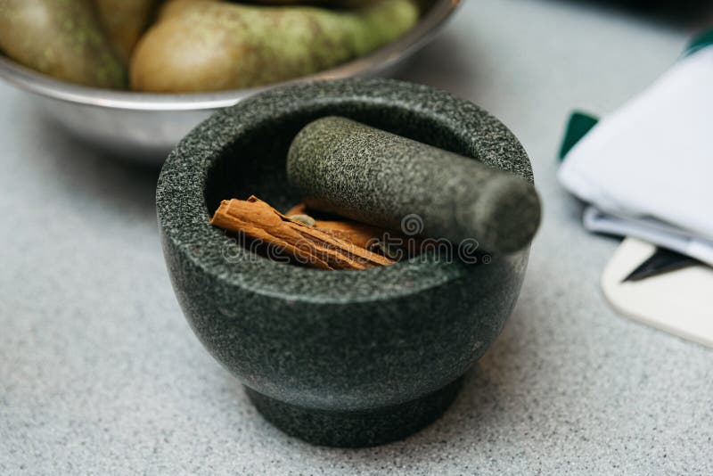 Mortar and Pestle with Spices on a Kitchen Table Stock Photo - Image of ...