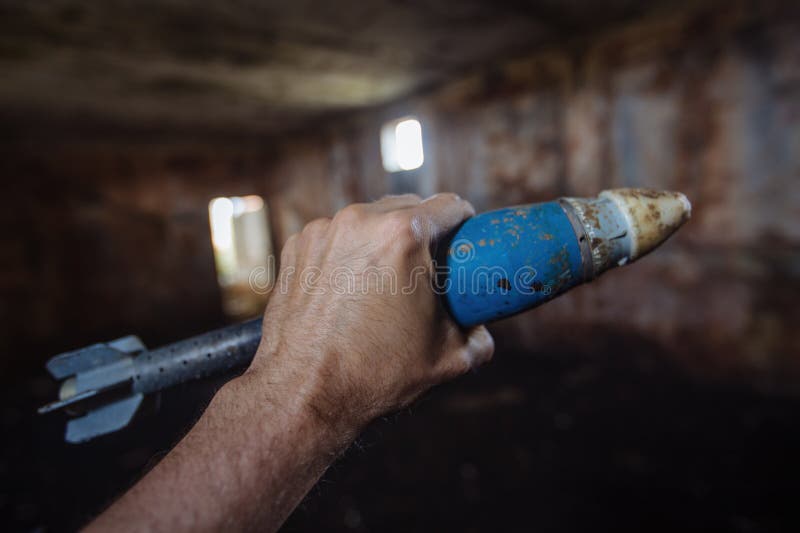 Mortar shell in man hand stock photo. Image of history - 273276942