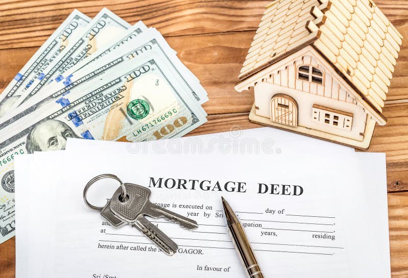 Mortgage Deed with Keys, Money and Model of House on the Table Stock ...
