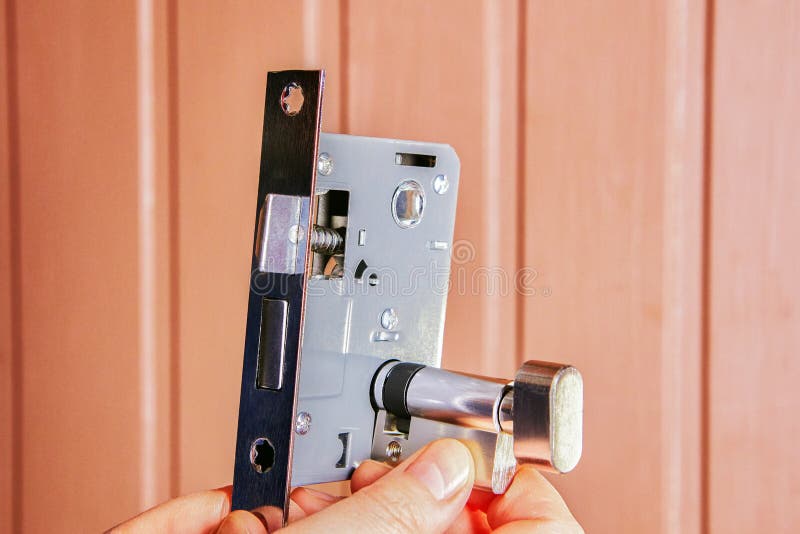 Installing Mortice Lock on Residential Door for Added Security. Stock ...