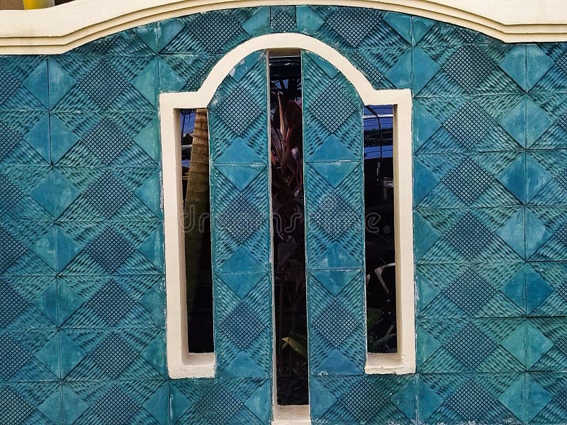 Elegant Mosaic Wall in Shades of Blue Features a Central Arched Window ...