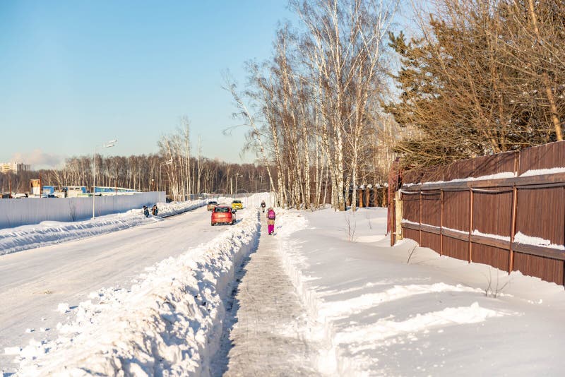 Snow-cleared walking paths editorial stock image. Image of slow - 211582129