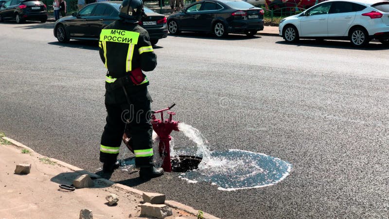 Fireman Setting Fire Hydrant and Opening Water Stream Stock Video ...