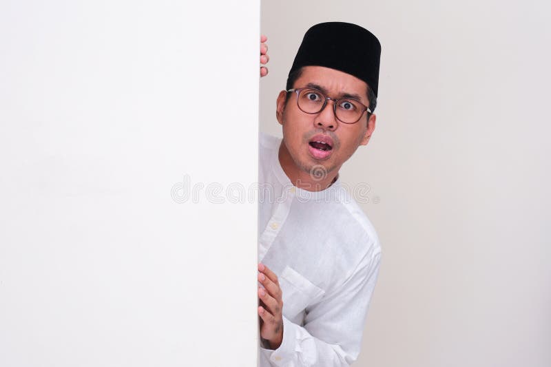 Moslem Man Peeking Behind White Billboard with Confused Face Expression ...