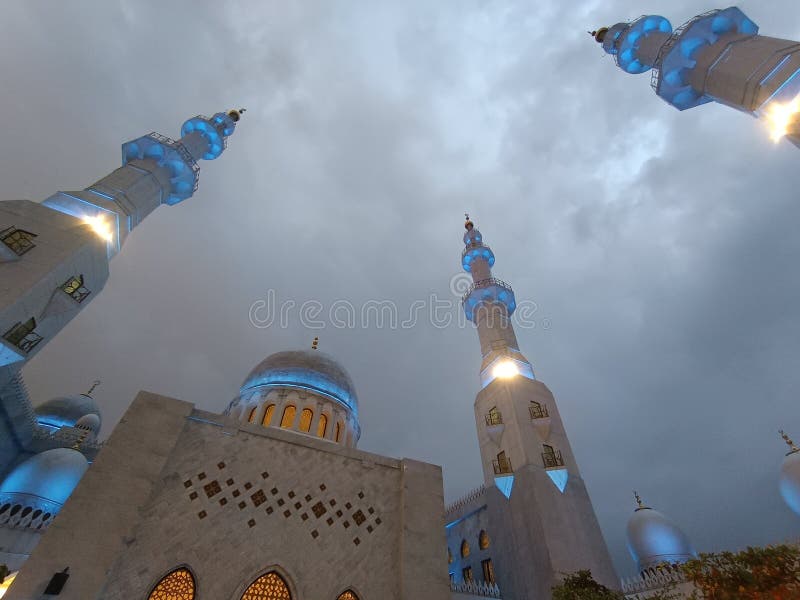 The Mosque with Blue Light Shines Beautifully Under the Gray Cloudy Sky ...