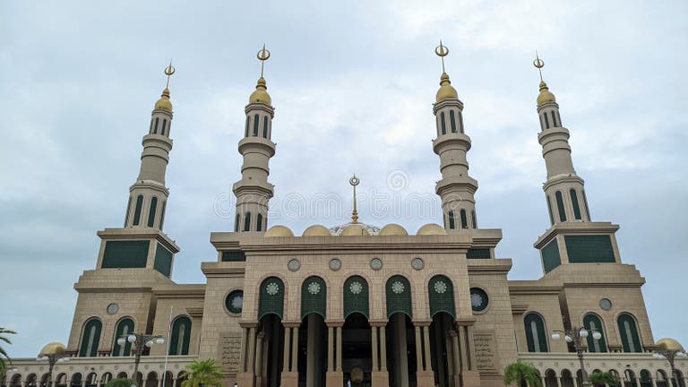 The Mosque Features Unique Architecture with Multiple Minarets and a ...