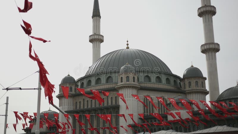 Mosque in Istanbul on Taksim Square. Waving Turkish Flags Stock Footage ...