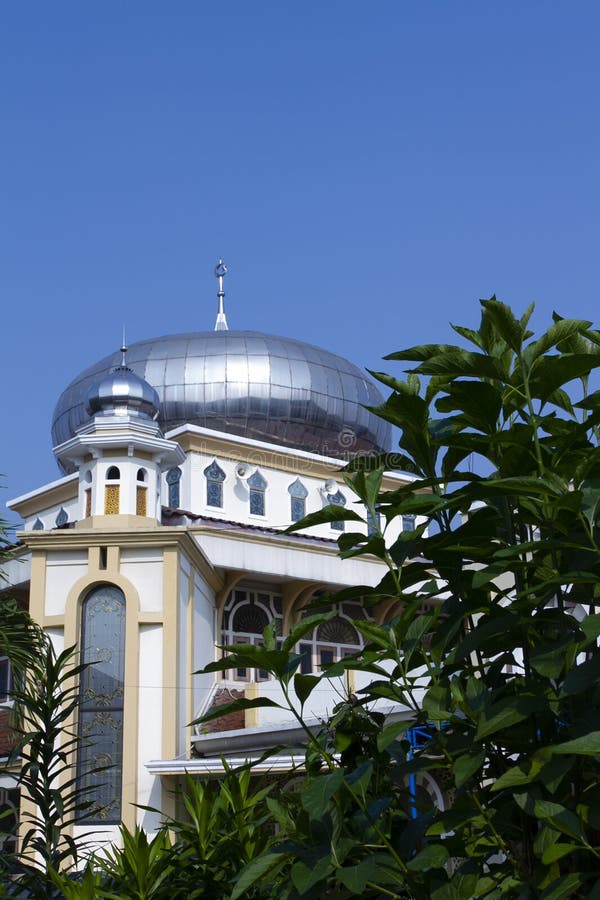 A Mosque with a Large Silver Dome and Two Smaller Domes Stock Image ...