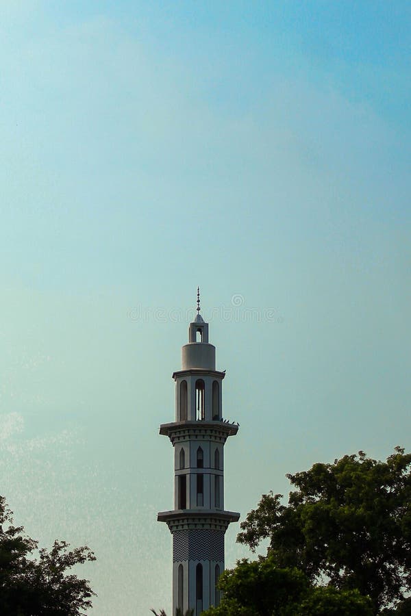 A Mosque Pillar / Minar between Two Trees Stock Photo - Image of ...