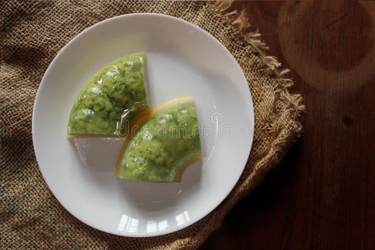 Fresh Moss Green Pudding Dessert on White Plate Over Burlap Background ...