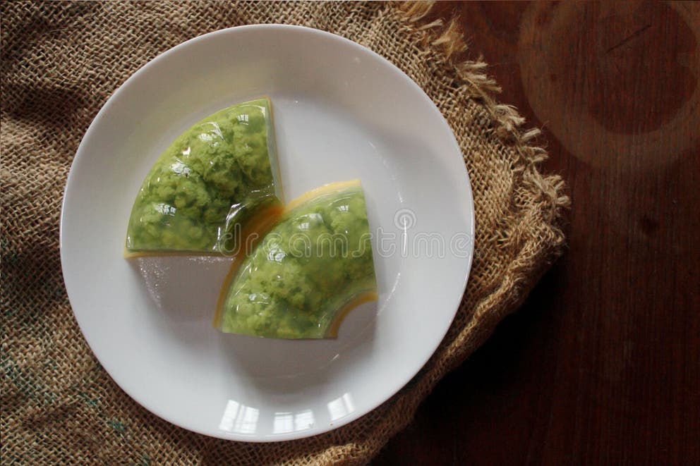 Fresh Moss Green Pudding Dessert on White Plate Over Burlap Background ...