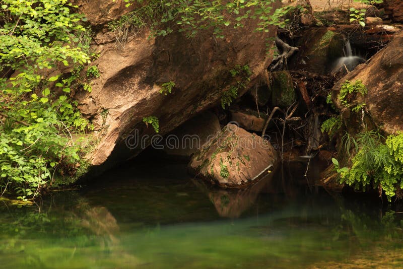 Mossy river with rocks stock photo. Image of refresh - 10705122
