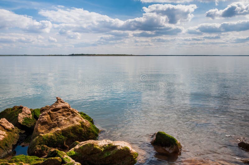 Mossy Rocks on on Lake stock photo. Image of lake, clouds - 42283552