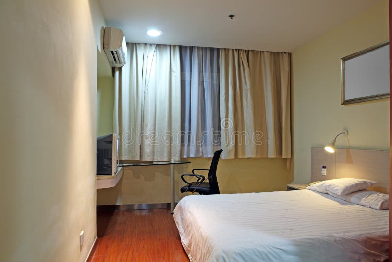 Simple hotel or motel room stock image. Image of interior - 14857773