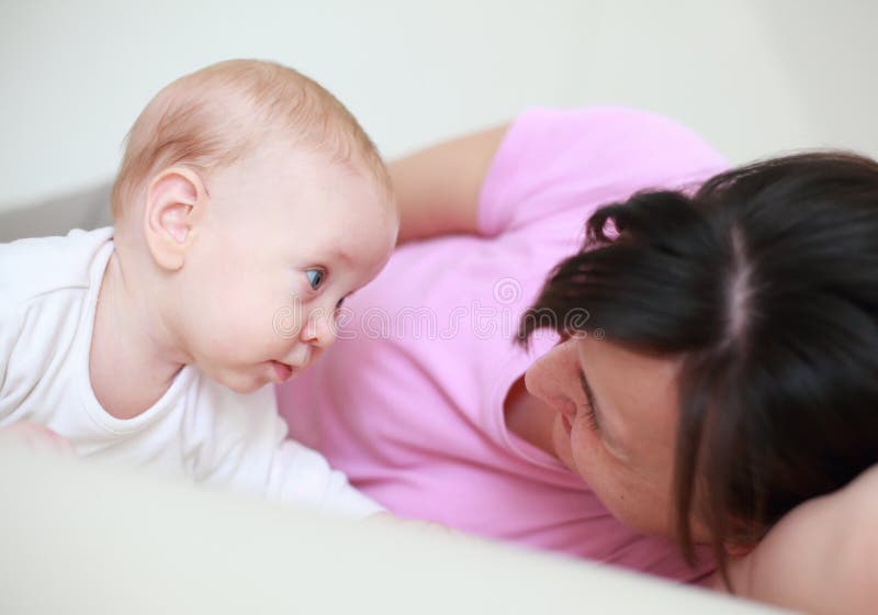 Mother Adore Her Cute Baby on Bed Stock Photo - Image of happy, baby ...