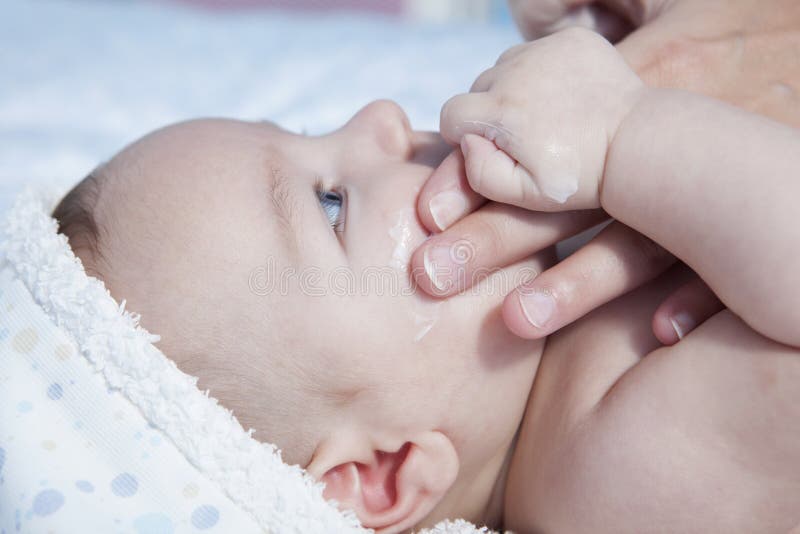 Mother Applying Cream Over Baby Boy Stock Photo - Image of milk, lying ...