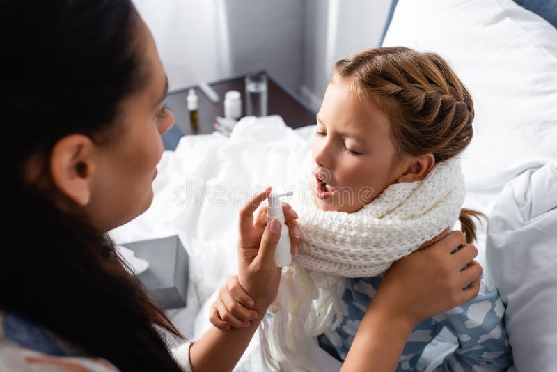 Mother Applying Spray On Sore Throat Stock Image Image Of Apply