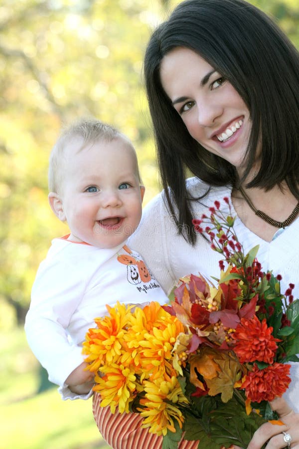 Mother and Baby Boy with Flowers - Fall Theme Stock Photo - Image of ...