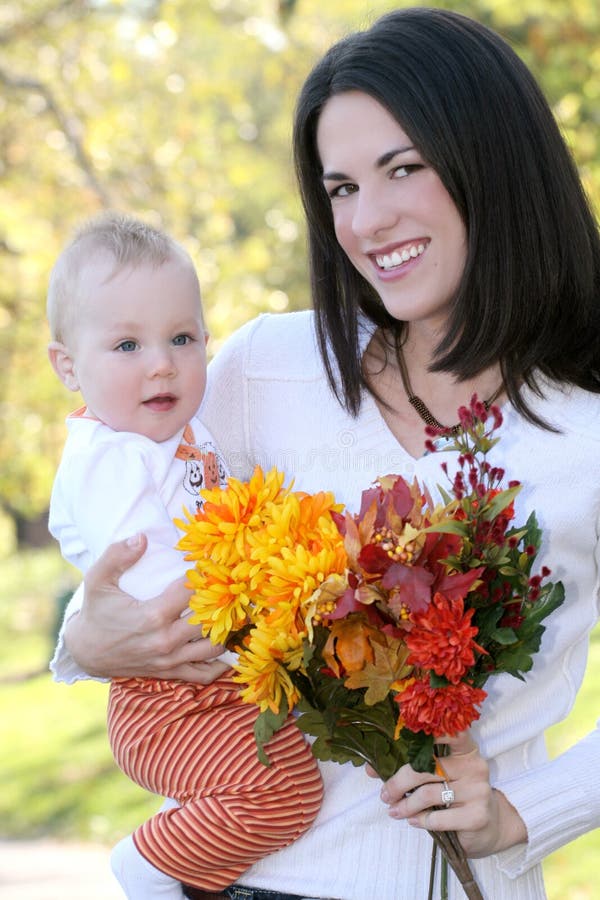 Mother and Baby Boy with Flowers - Fall Theme Stock Image - Image of ...
