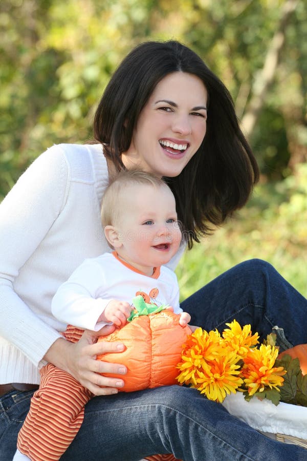 Mother and Baby Boy with Leaves - Fall Theme Stock Photo - Image of ...