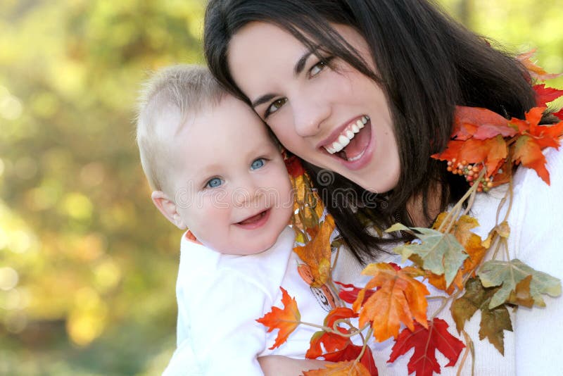 Mother and Baby Boy with Leaves - Fall Theme Stock Photo - Image of ...