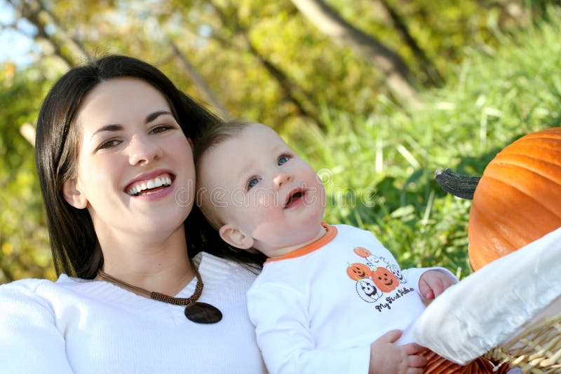 Mother and Baby Boy with Pumpkin - Fall Theme Stock Image - Image of ...