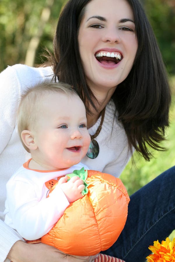 Mother and Baby Boy with Leaves - Fall Theme Stock Photo - Image of ...