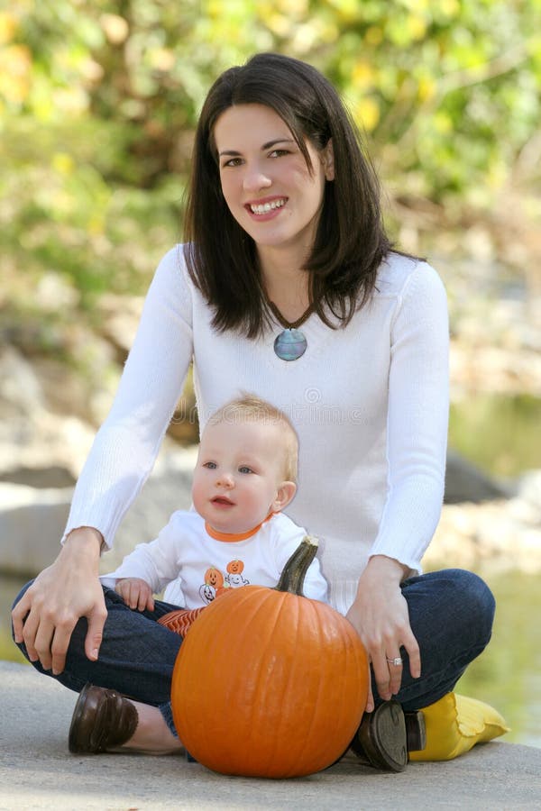 Mother and Baby Boy with Leaves - Fall Theme Stock Photo - Image of ...