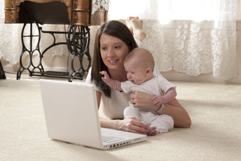 Mother and Baby at Home Using Laptop Computer Stock Photo - Image of ...
