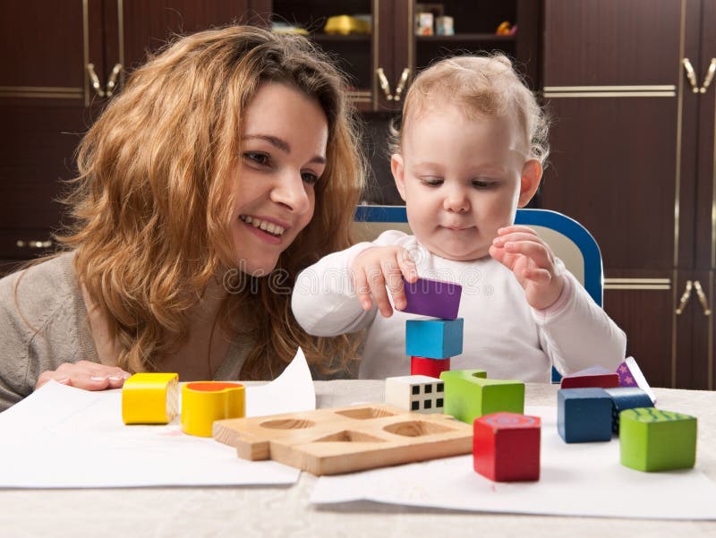 Mother and Baby Daughter Building Tower Stock Photo - Image of female ...