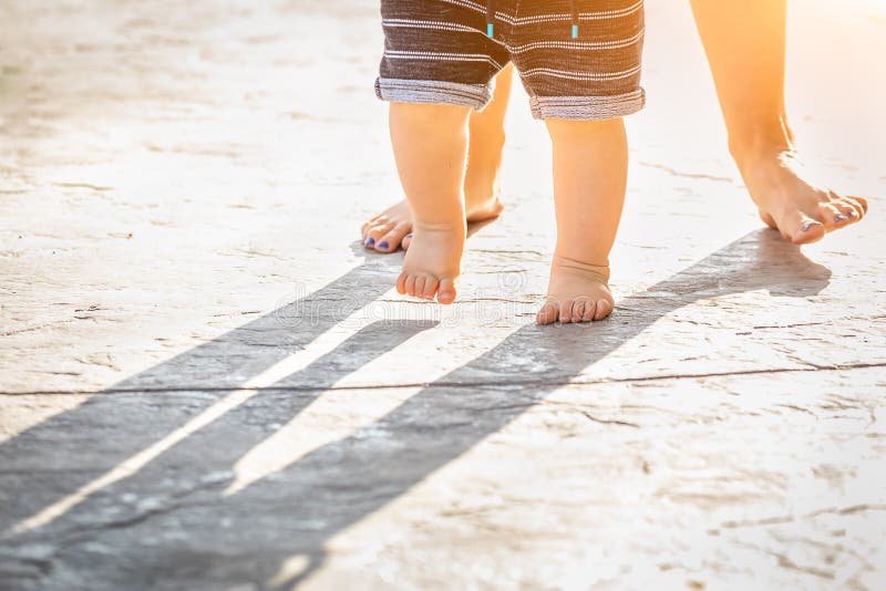 Mother and Baby Feet Taking Steps Outdoors Stock Image - Image of small ...
