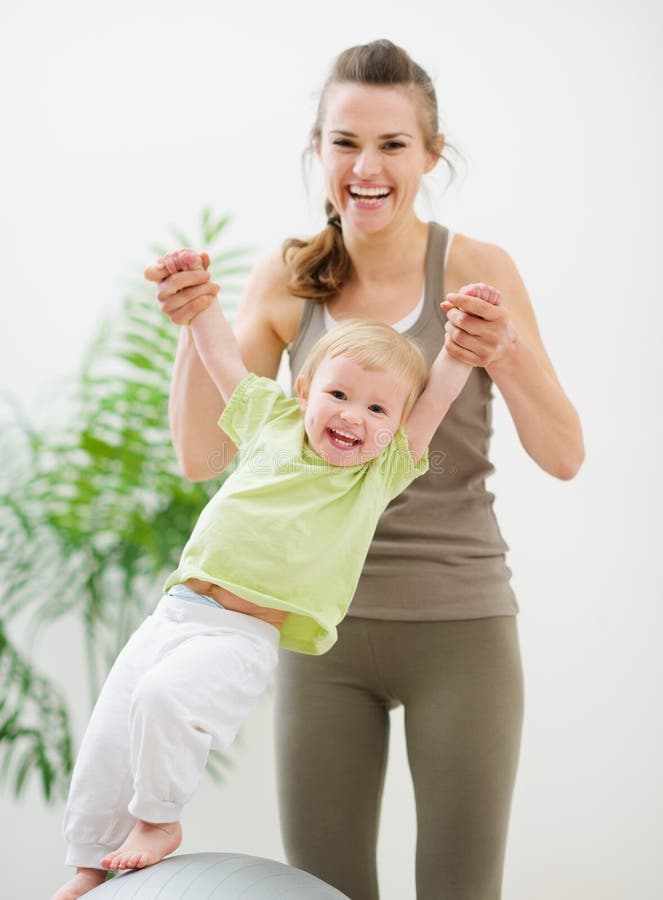 Mother and Baby Having Fun in Gym Stock Photo - Image of healthy ...