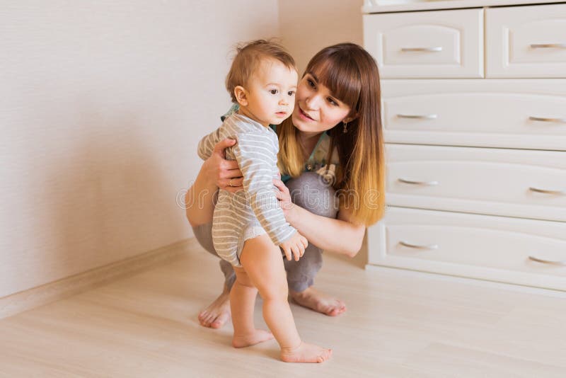 Mother and Baby Legs. First Steps Stock Image - Image of care, birth ...