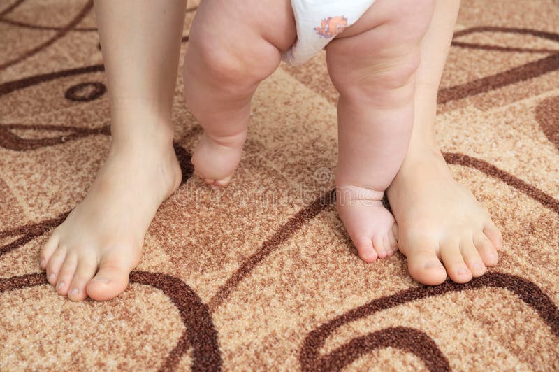 Mother and Baby Legs Stepping. First Steps. Stock Image - Image of ...