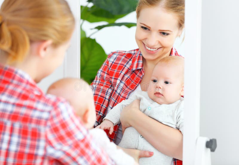 Mother and Baby Look in the Mirror at Home Stock Image - Image of face ...