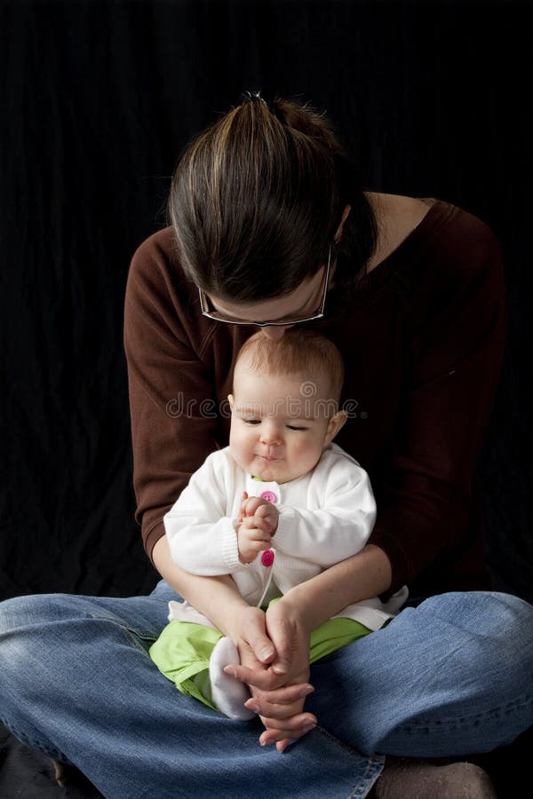 Mother and baby praying stock photo. Image of religion - 13441978
