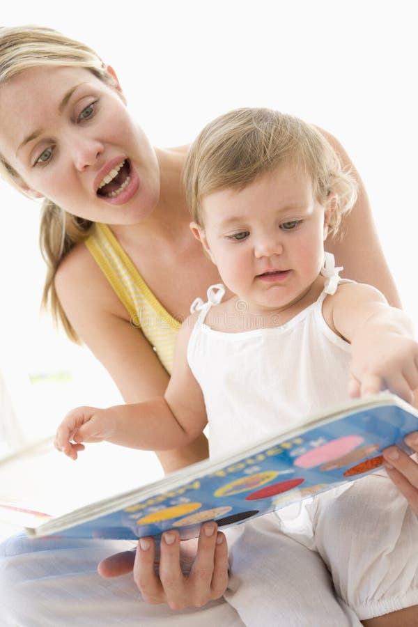 Mother and Baby Reading Book Indoors Stock Photo - Image of literacy ...