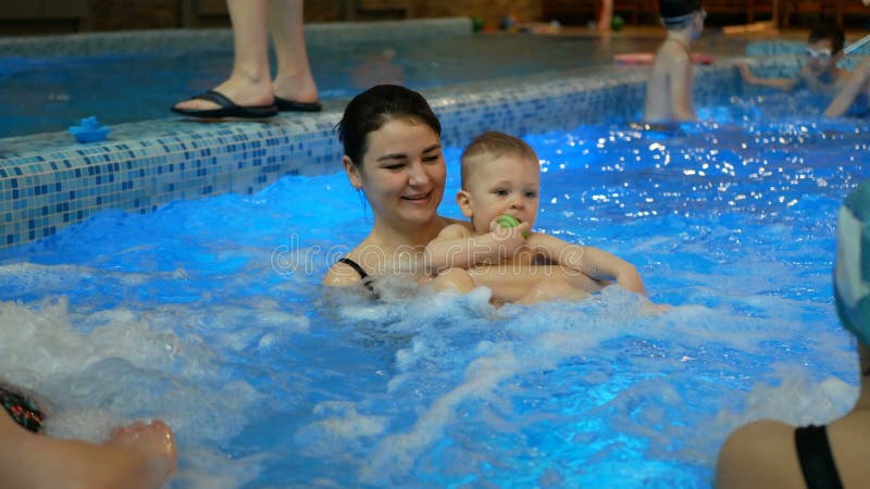 Mother and Baby Swim in the Pool. Stock Footage - Video of mother ...