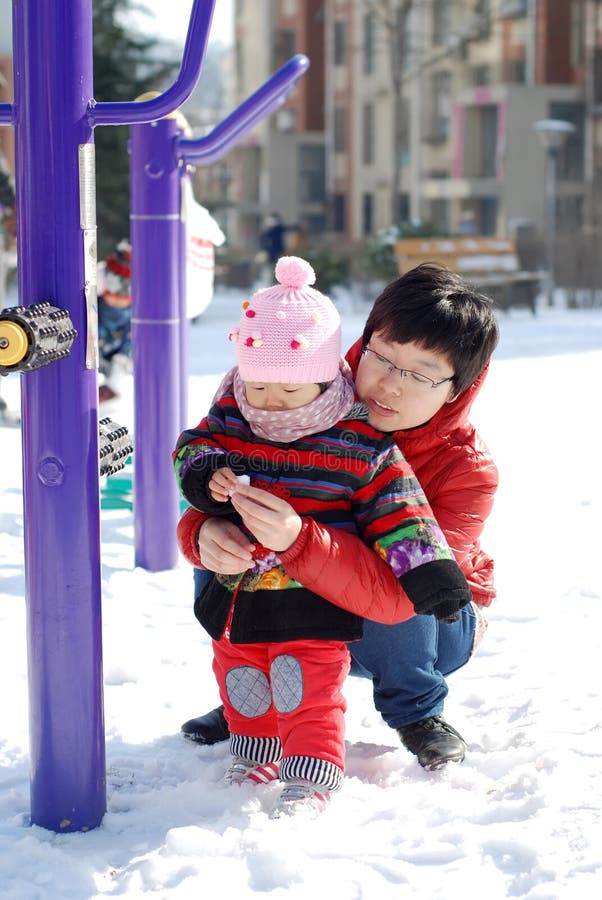 Mother and Baby To Play in the Snow Stock Photo - Image of jacket ...