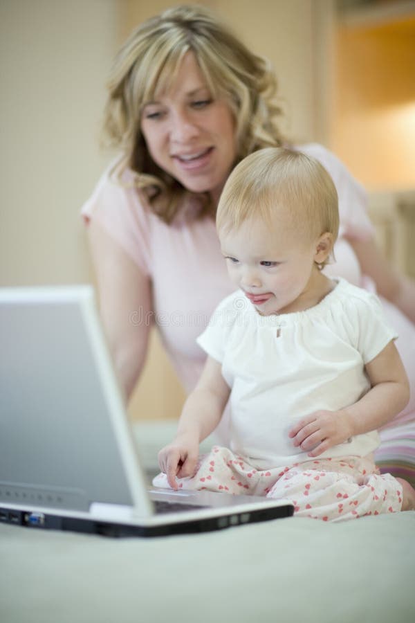 Baby with Mother Working on Laptop Stock Image - Image of motherhood ...