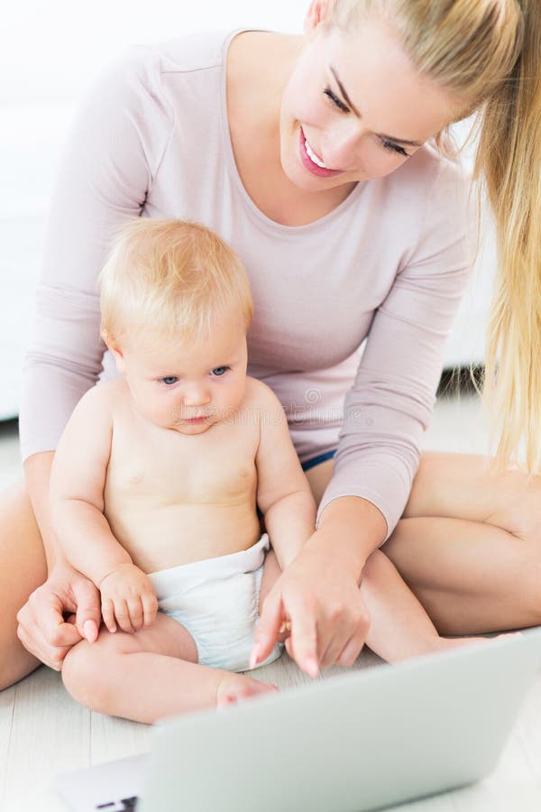 Mother and Baby Using Laptop Stock Image - Image of expression ...