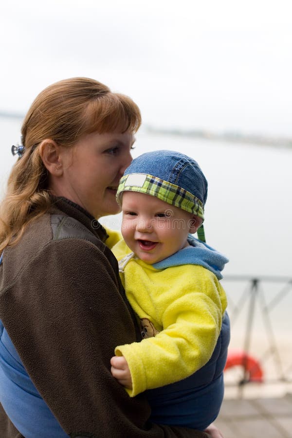 Mother carry baby in sling stock photo. Image of carrier - 4271780