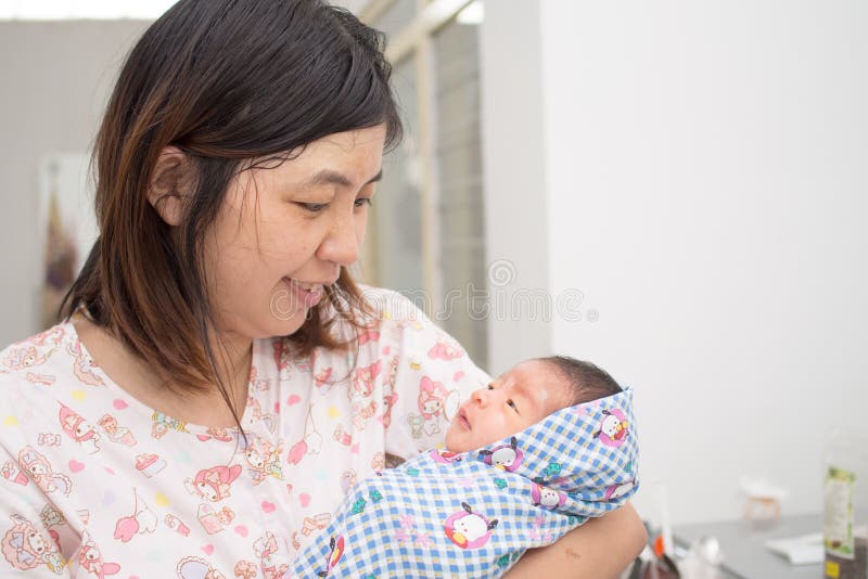 Mother Carrying Her Powdered Baby Stock Image - Image of child, asian ...
