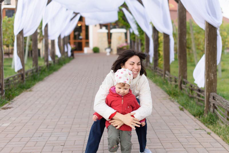 Mother Catching Daughter stock image. Image of cute, healthy - 48416823